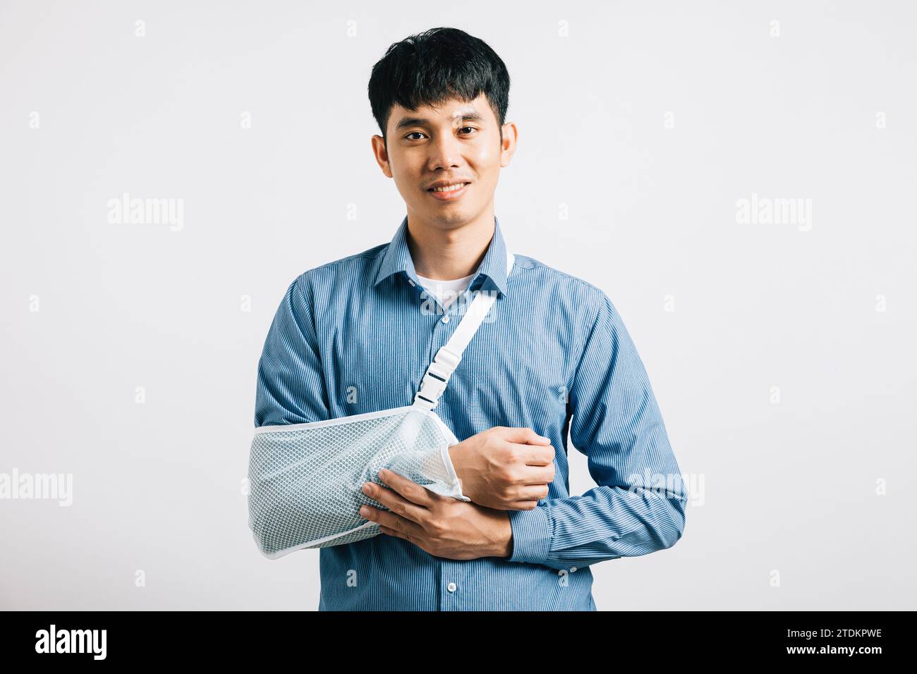 happy Asian man wears arm support in studio shot isolated Stock Photo ...