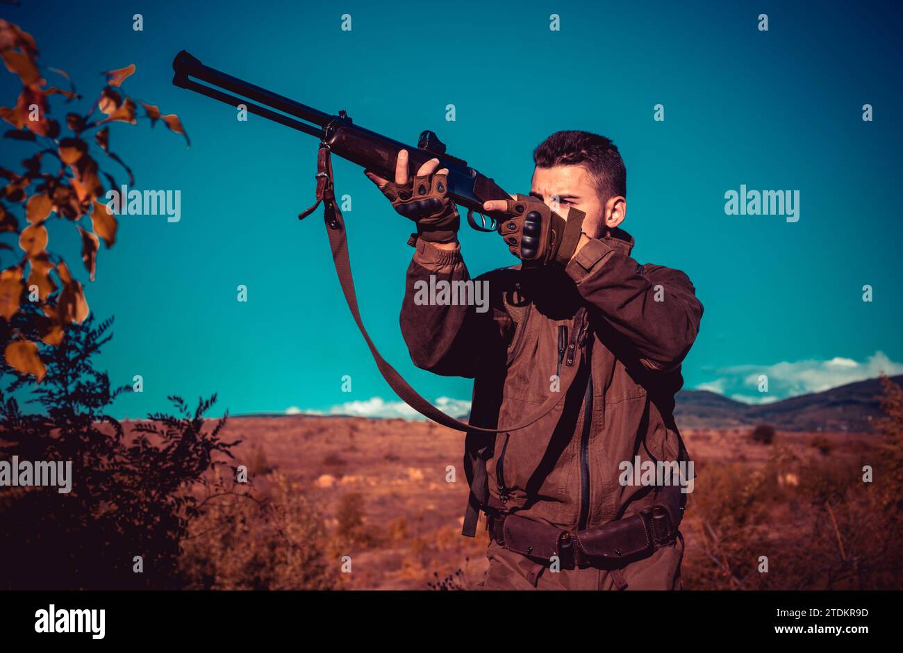 Hunter with shotgun gun on hunt. Calibers of hunting rifles. Hunter ...