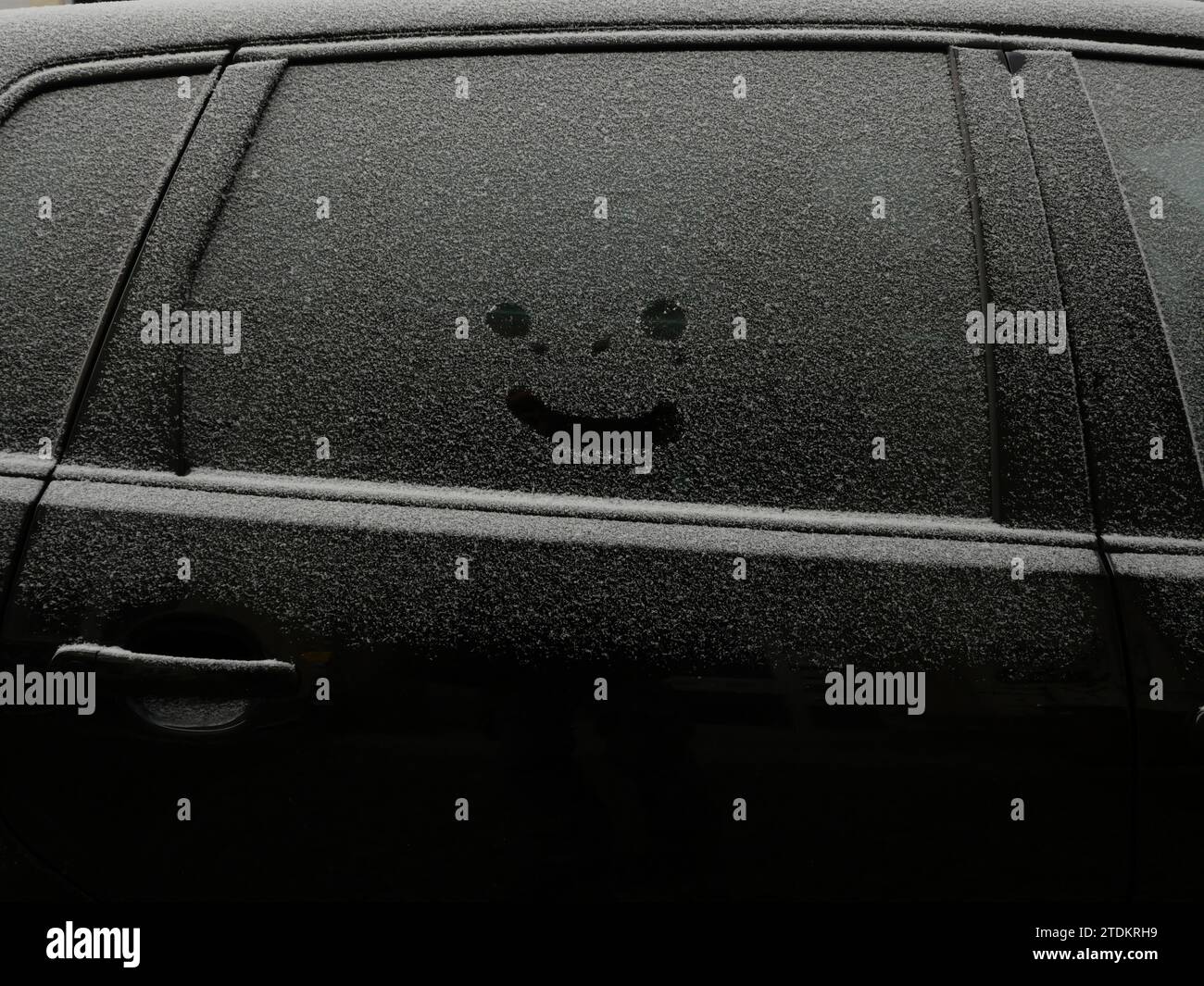 smiley in snow on car window Stock Photo - Alamy