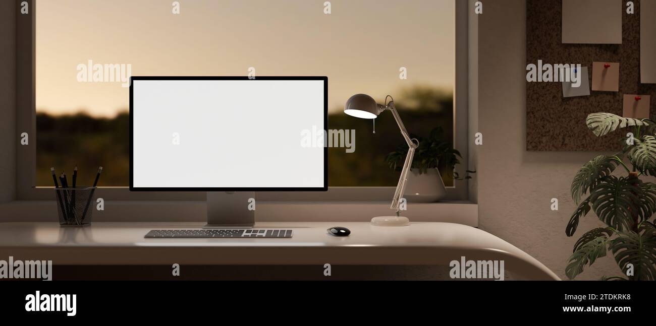 Modern home office in the evening with a white-screen computer, a table ...