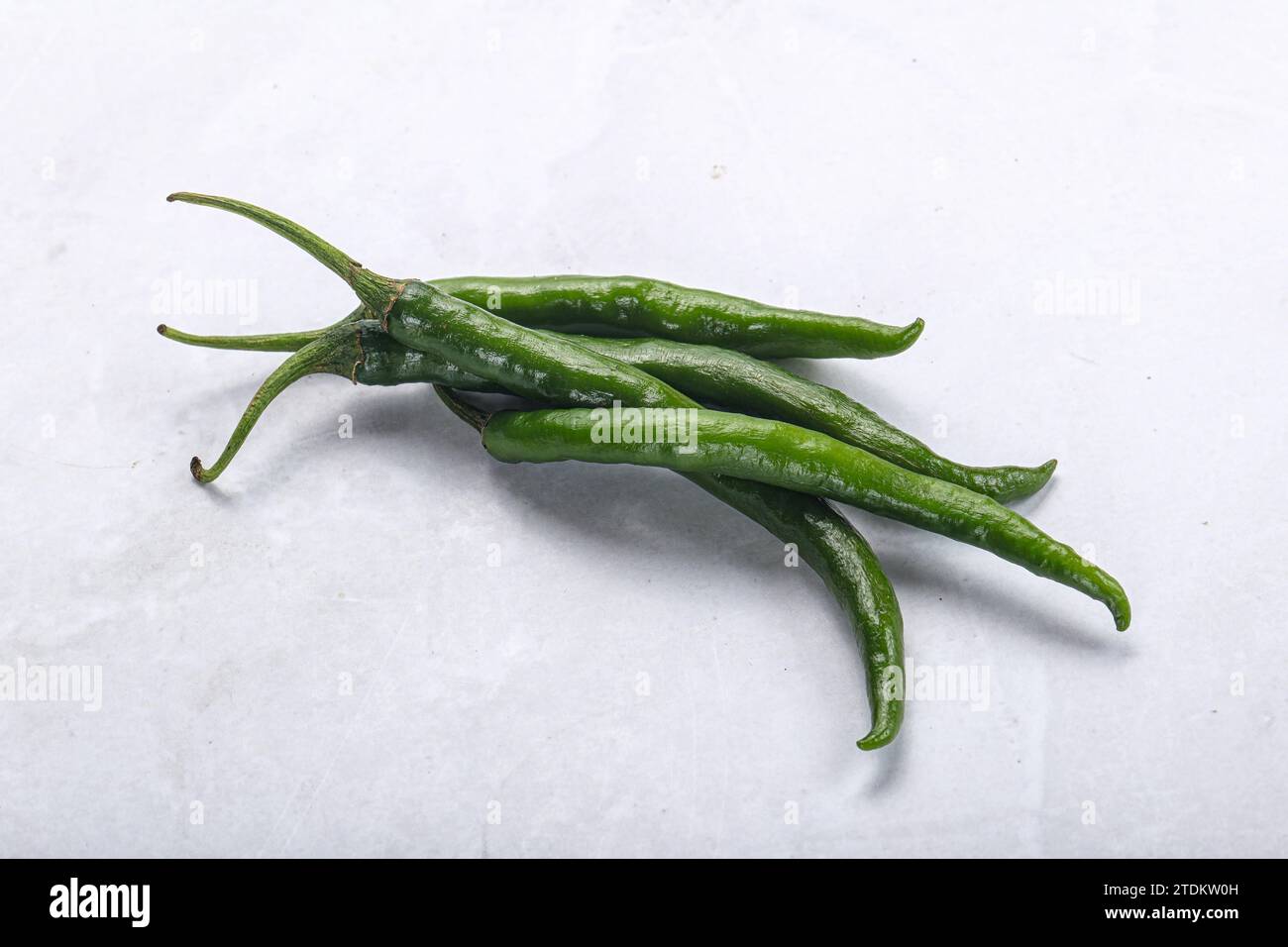 Hot and spicy green chili pepper heap Stock Photo - Alamy