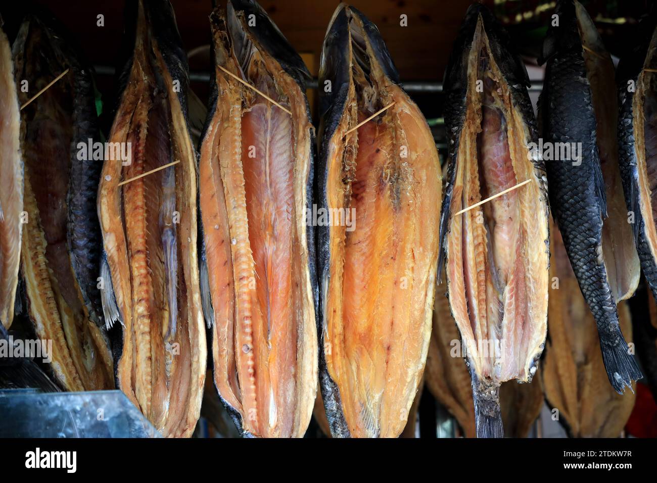 Strings of cured meat and fish are hung up in a market in Huai'an City ...