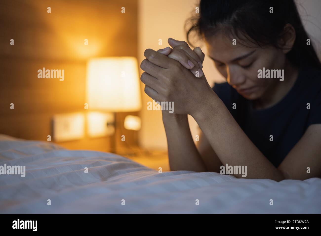 Christian woman praying in bedroom, woman hands praying to god, begging for forgiveness and ...