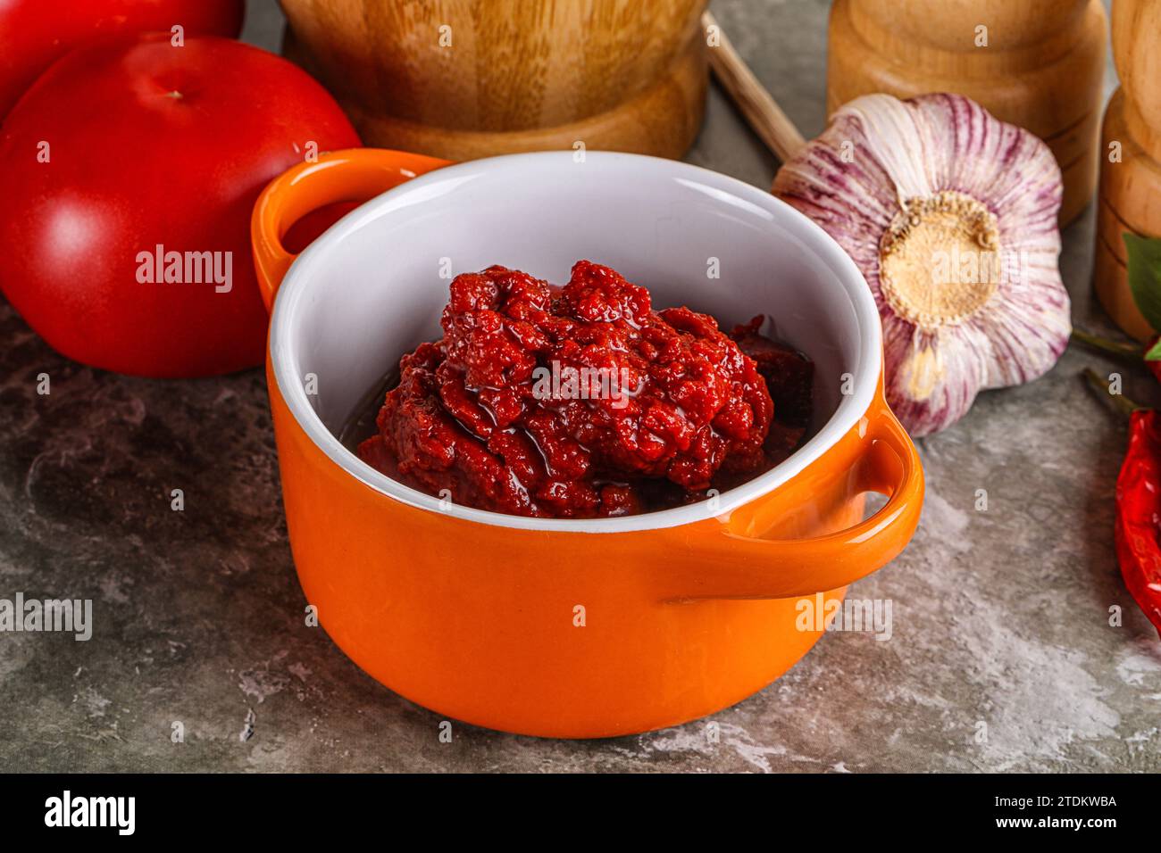 Natural organic red tomato paste in the bowl Stock Photo - Alamy