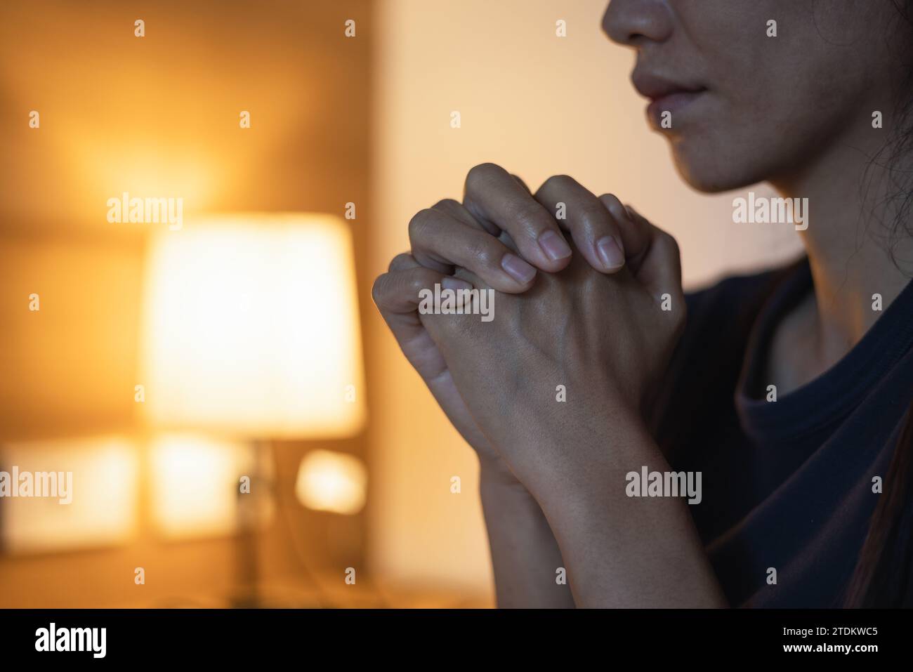 Christian woman praying in bedroom, woman hands praying to god, begging for forgiveness and ...