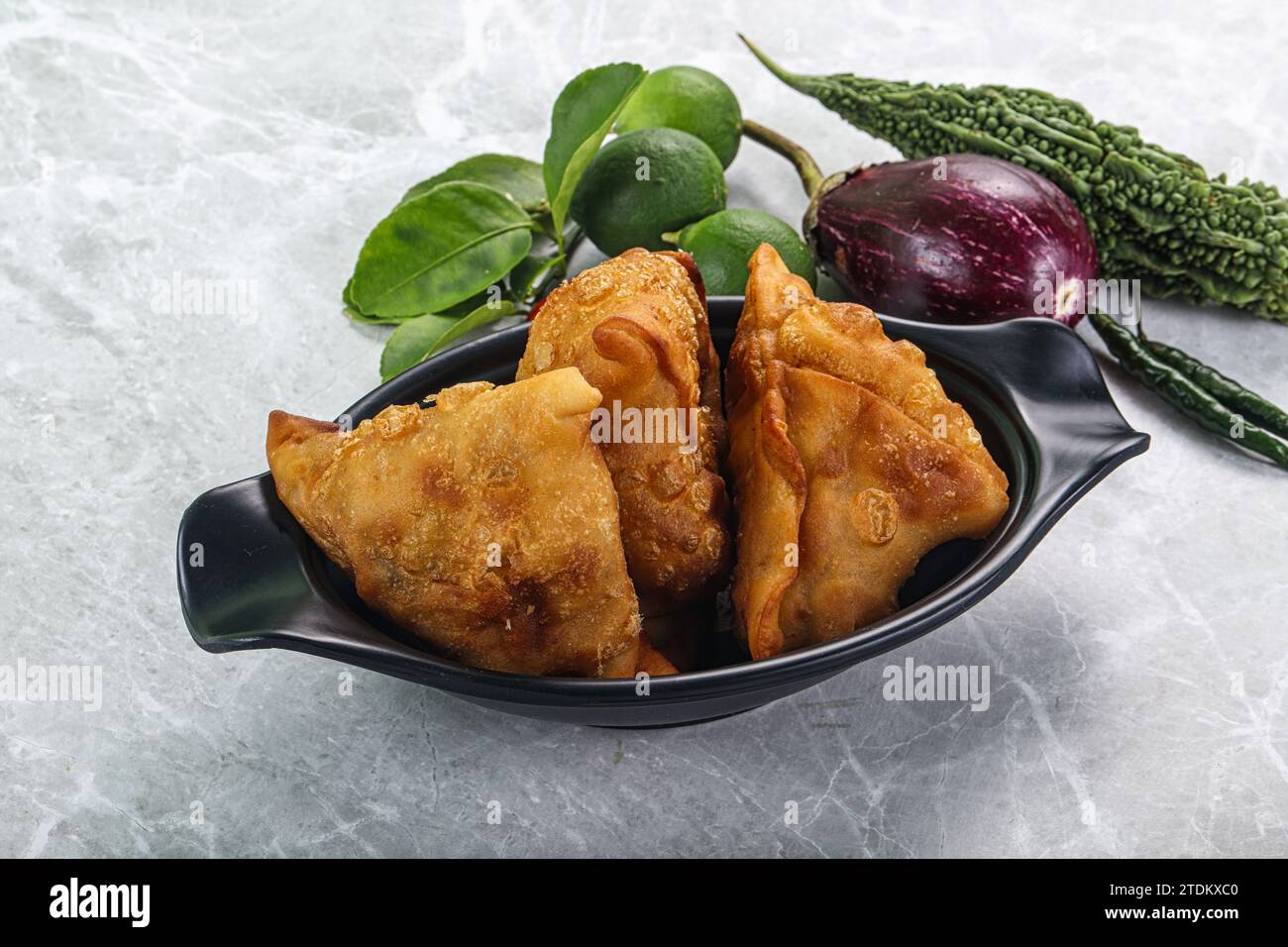 Indian cuisine - fries crispy stuffed samosa Stock Photo - Alamy
