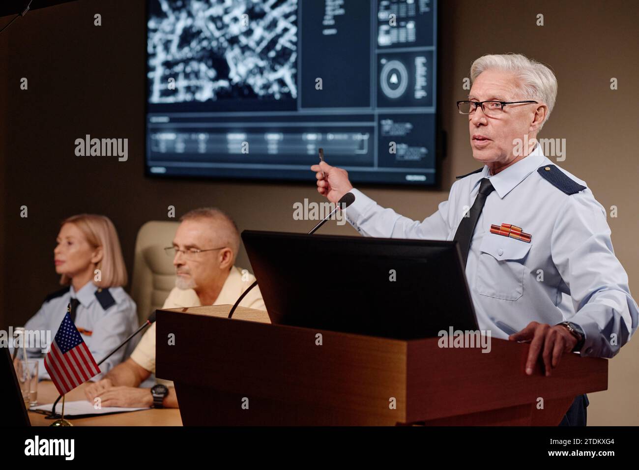 Politician pointing at screen and explaining situation in the country ...