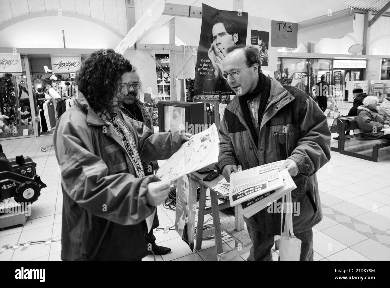 Handing out newspaper hi-res stock photography and images - Alamy