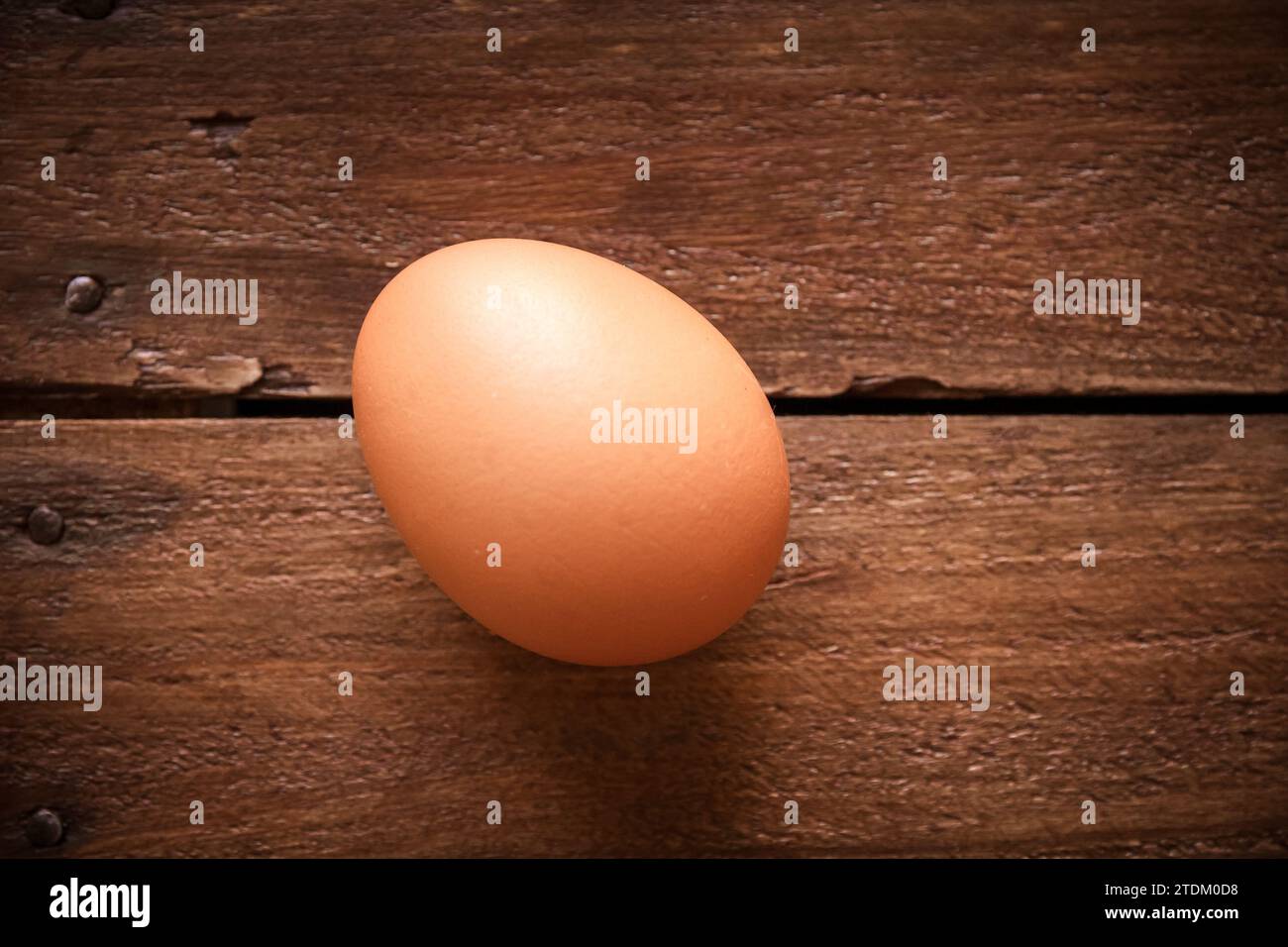 Fresh egg on a rustic wooden board background Stock Photo - Alamy