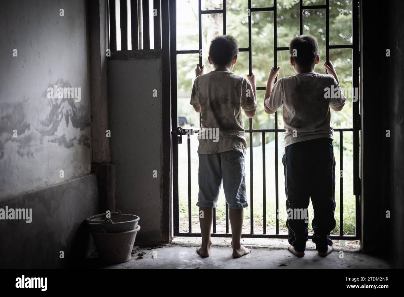 Children who were imprisoned in a room with a steel cage. The concept ...