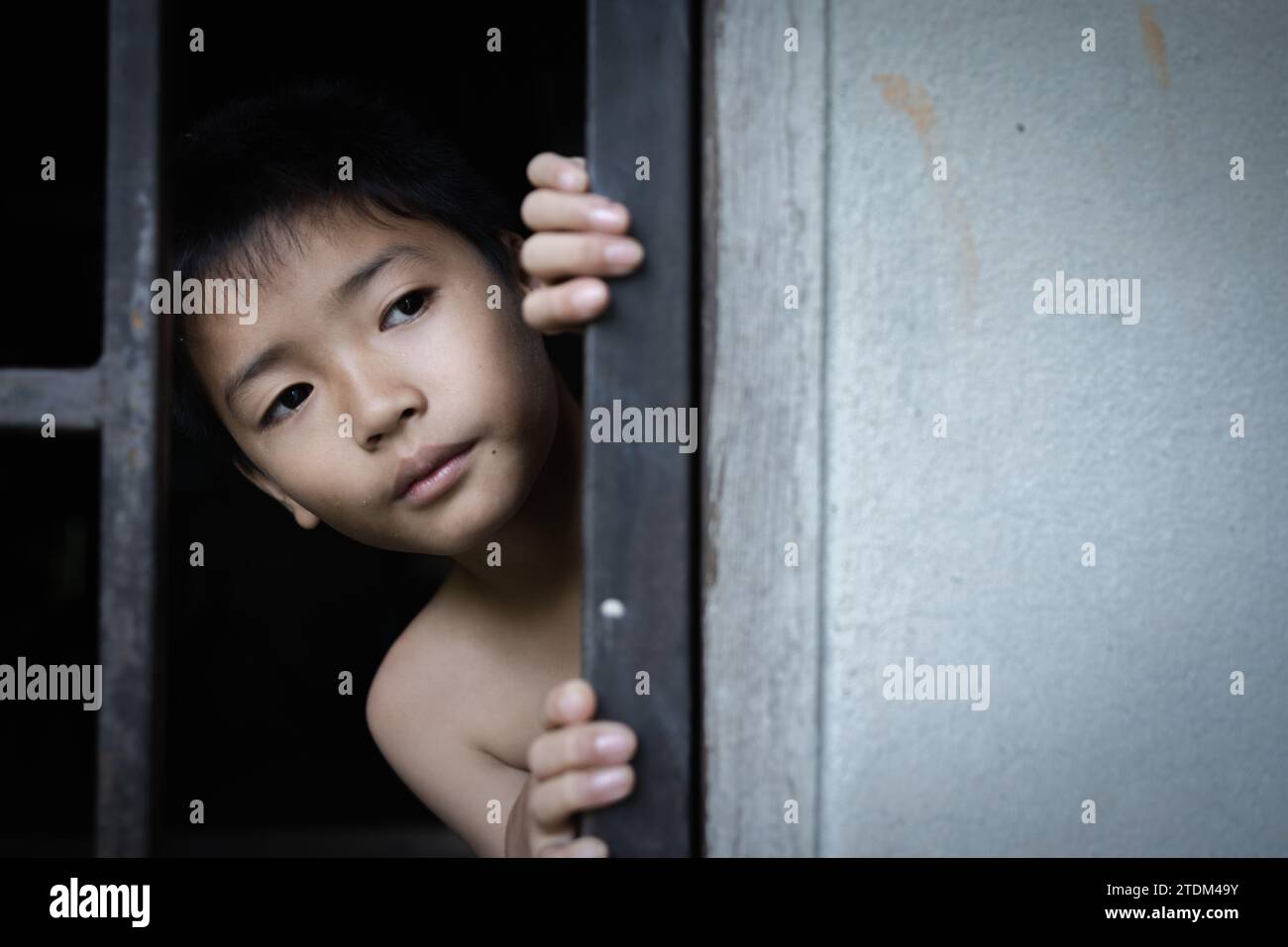 The child captured the iron cage with sadness and despair. The concept of stopping violence ...