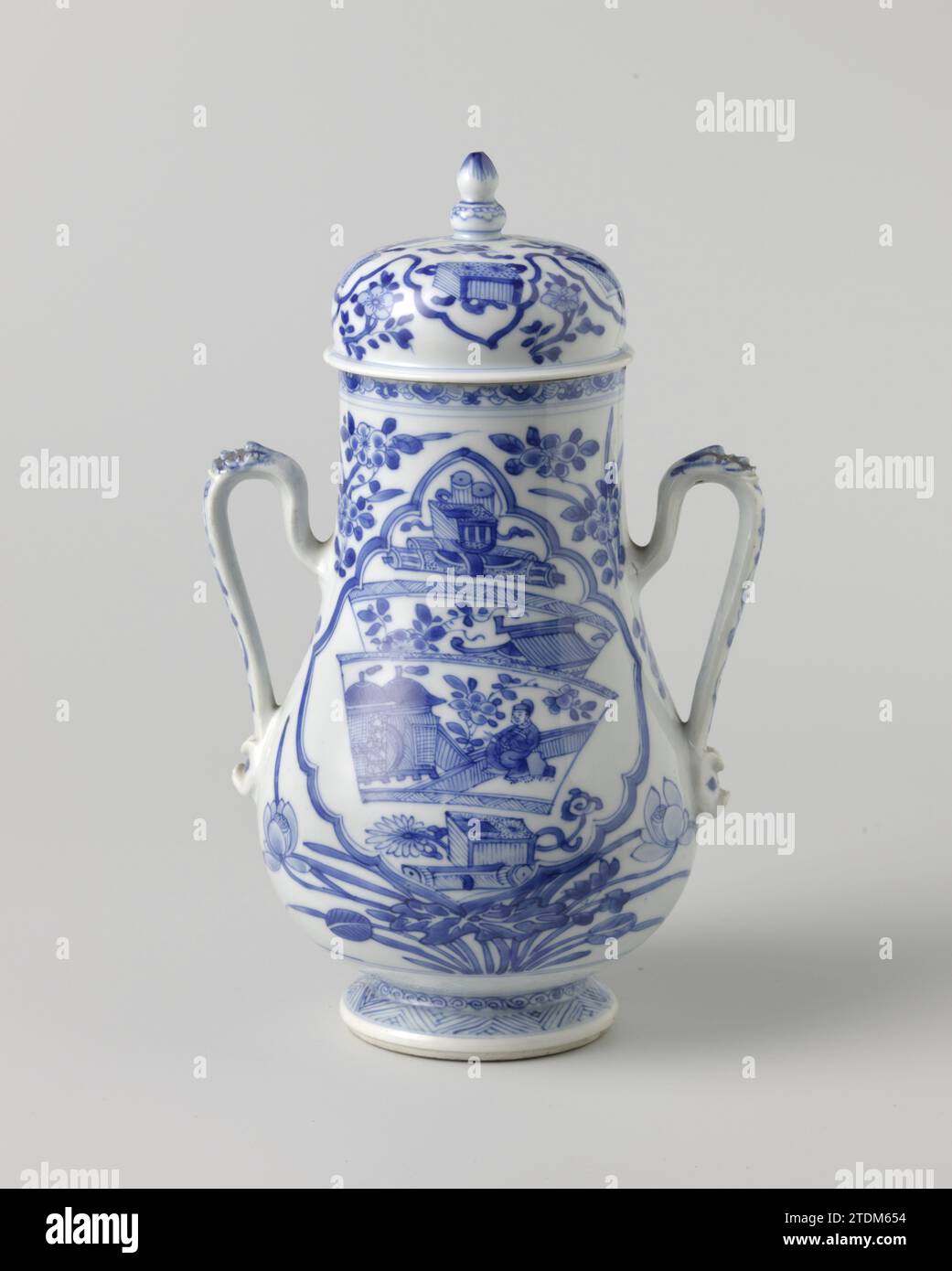 Pear-shaped covered jar with precious objects and flower sprays ...