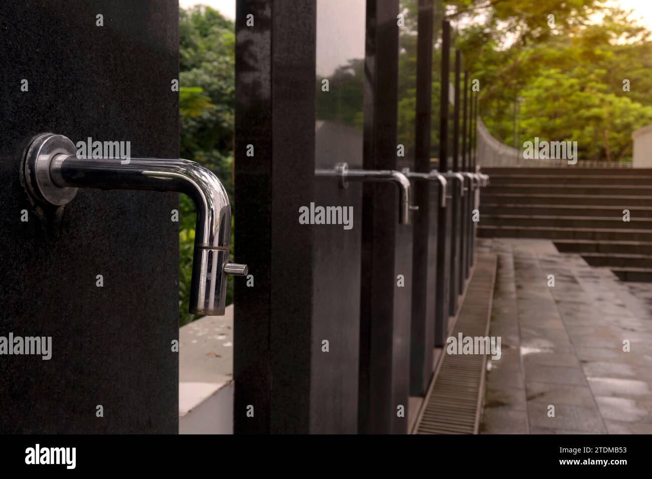 A row of water tap ablution places for Muslims before entrance or ...