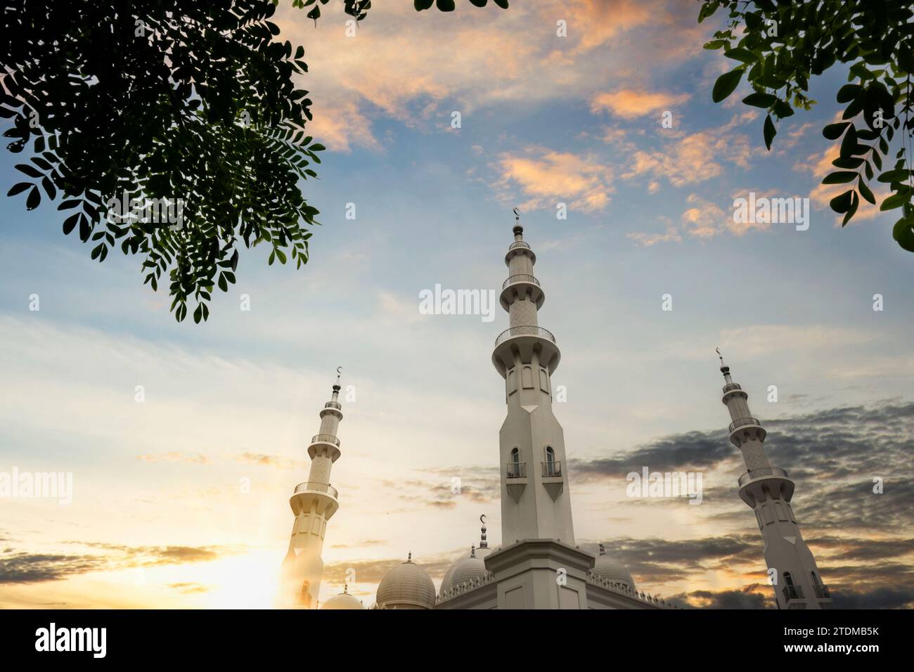 The dome and minaret of the mosque with sunset scene background Stock ...