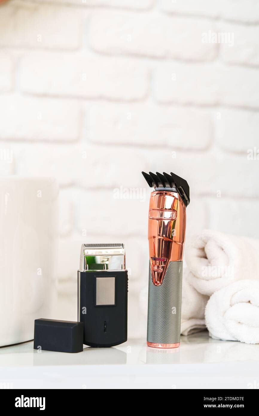 Electric shaver for men in a bathroom close up Stock Photo - Alamy