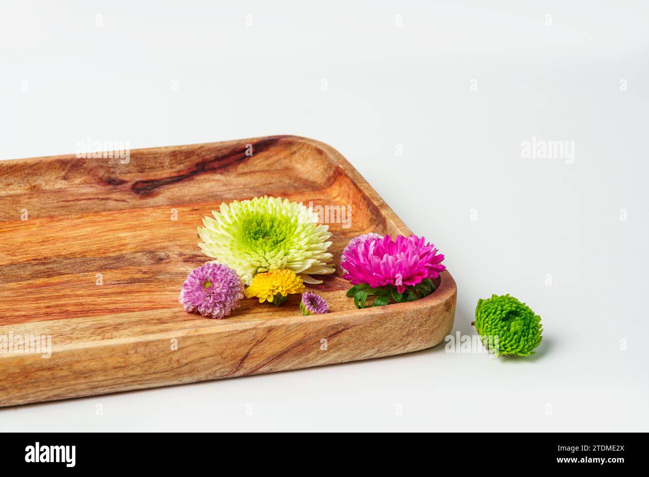 Wooden tray with flowers isolated on white background Stock Photo - Alamy