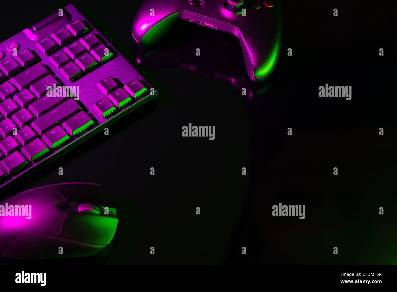 Computer keyboard, mouse and joystick on black background Stock Photo ...