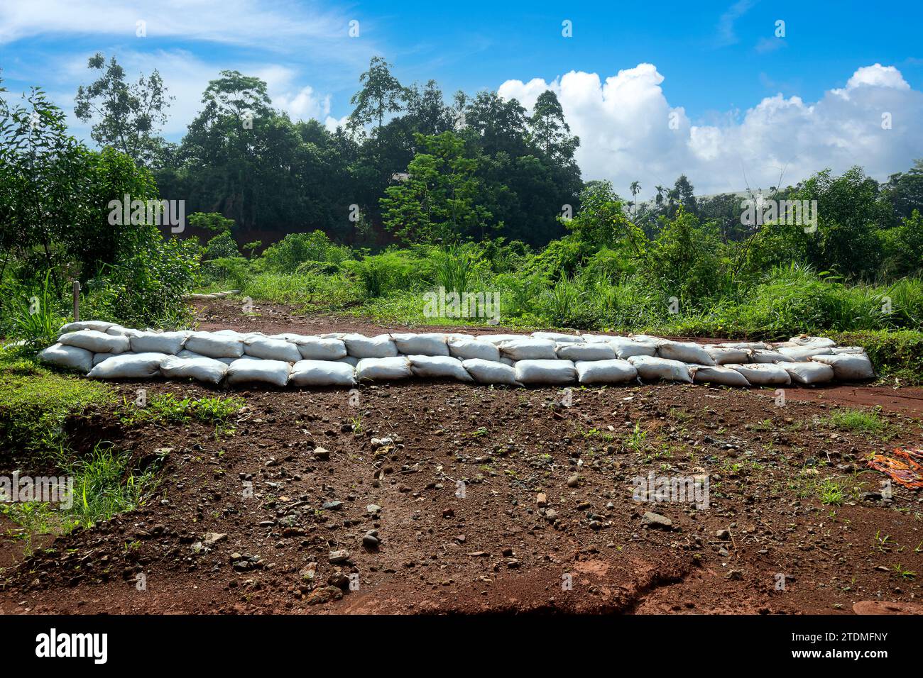 Stacked sandbags on the field Stock Photo - Alamy