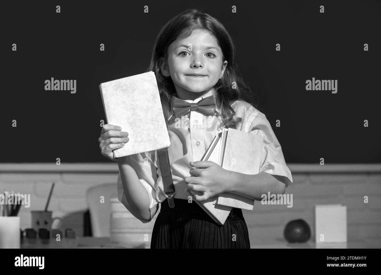 Cute little child studying in classroom at elementary school. Genius ...