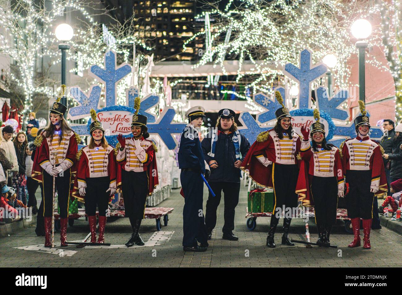 A performer waves at the parade spectators in Bellevue. Nearly a ...
