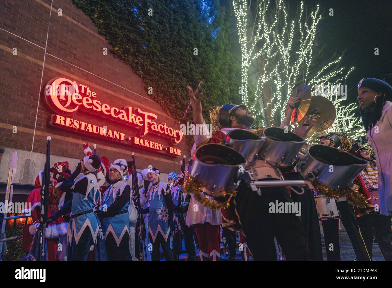 A performer waves at the parade spectators in Bellevue. Nearly a ...
