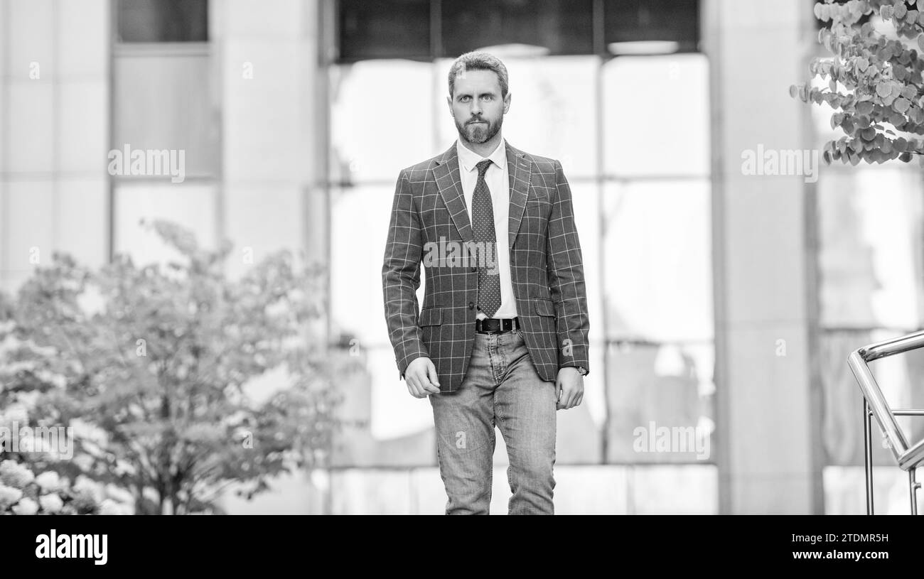 walking business manager on urban background. business manager wearing ...