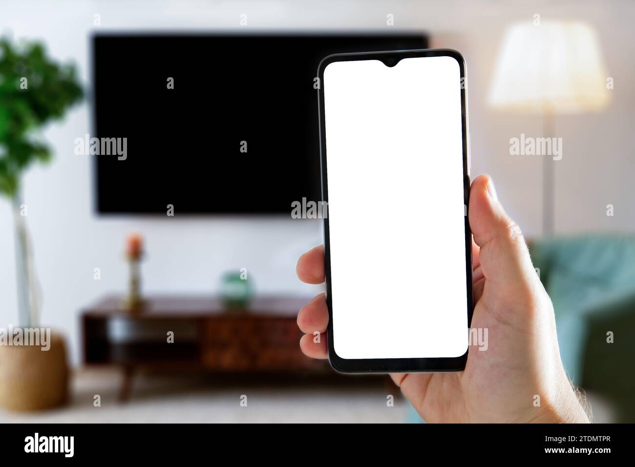 Close-up Of Man's Hand Holding Mobile With White Screen for Smart Home ...