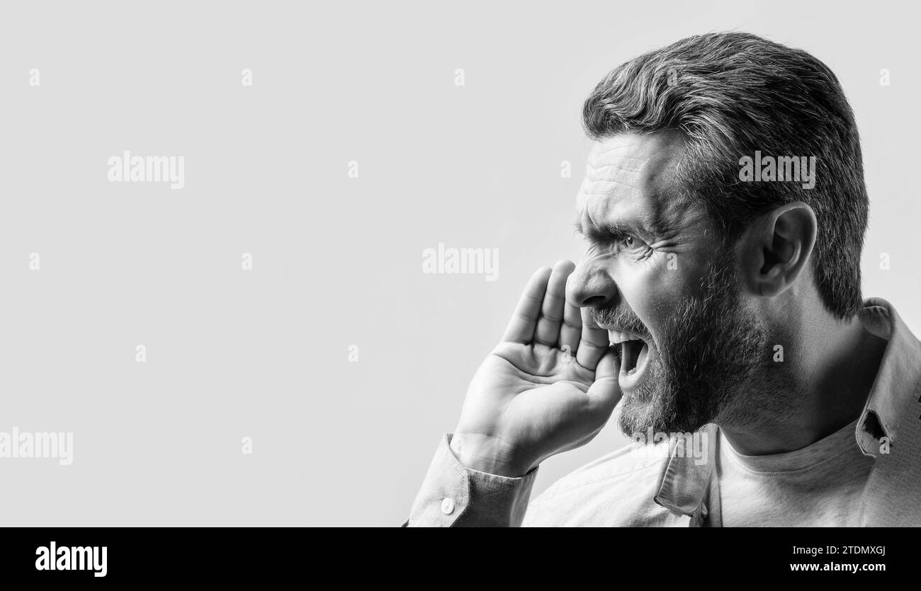 man with shouting face isolated on studio background, copy sace banner ...