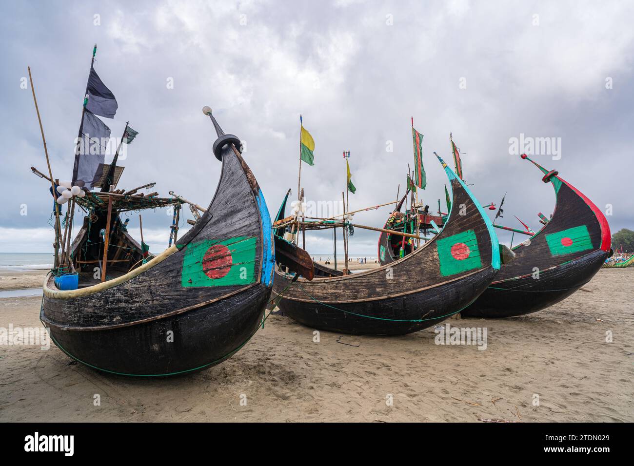 View of three traditional wooden fishing boats known as moon boats ...