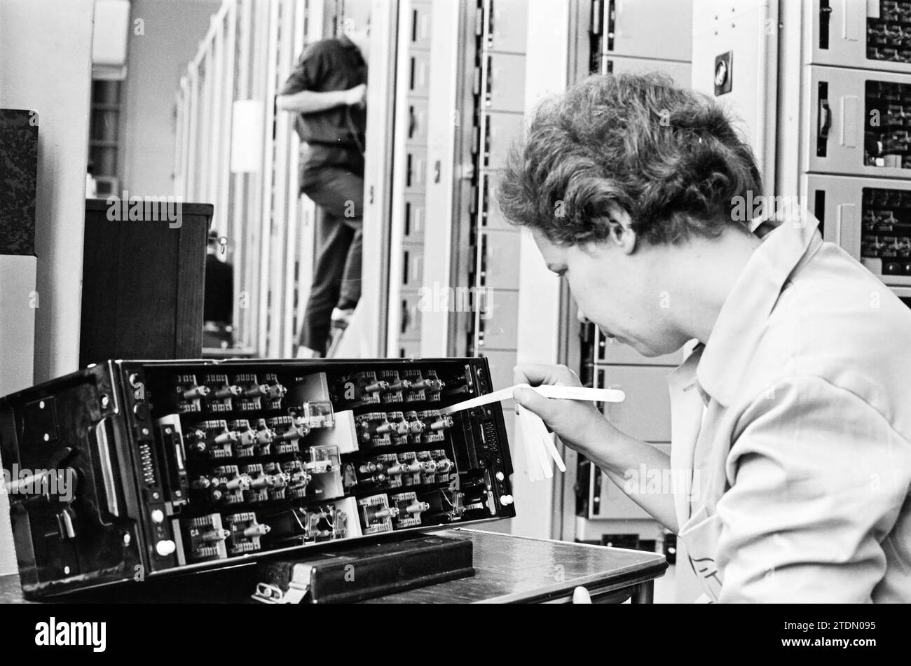 Woman working at a switchboard of a telephone exchange, Whizgle News from the Past, Tailored for ...