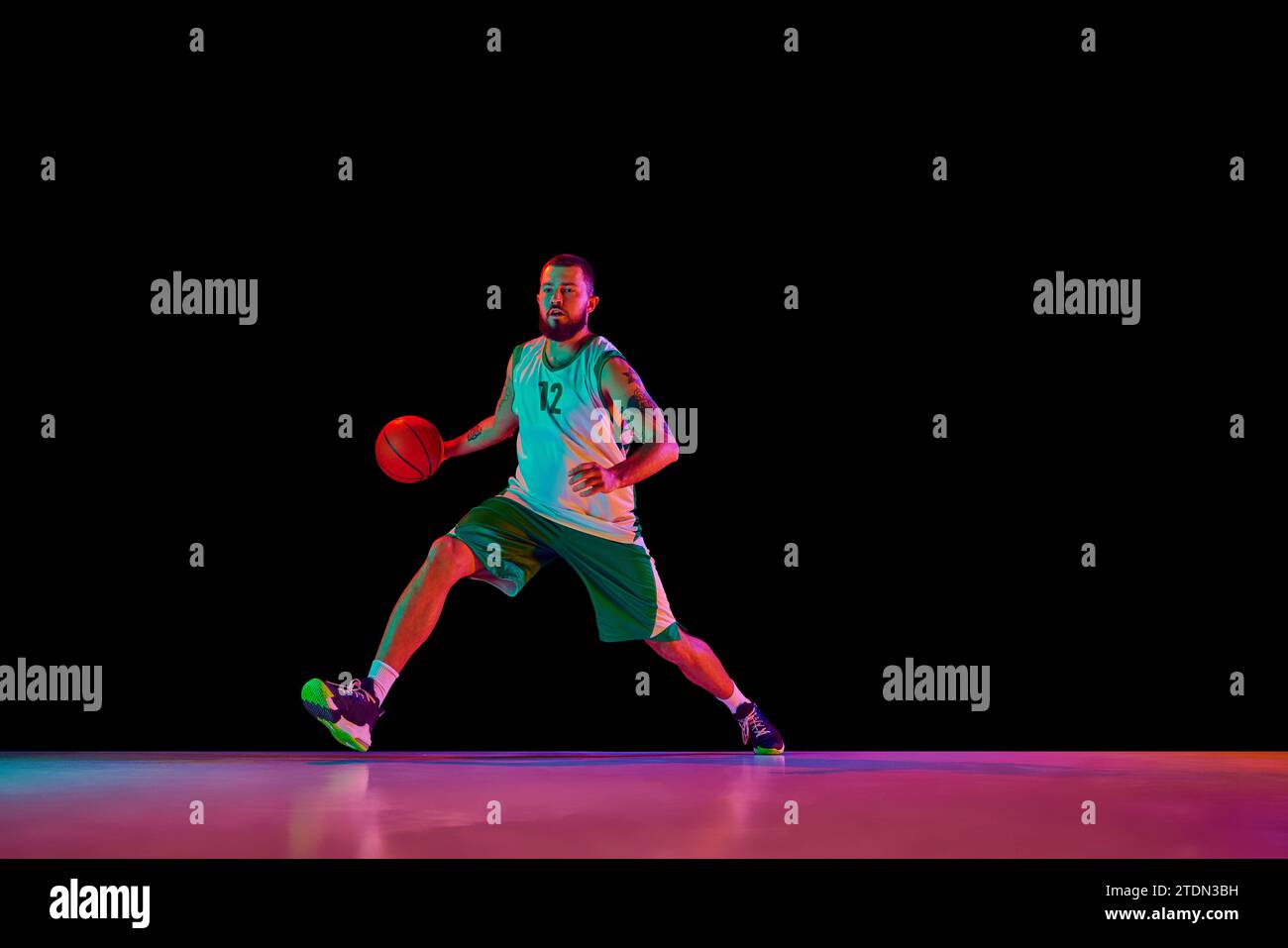 Dynamic shot capturing skilled basketball player in action, focused and ...
