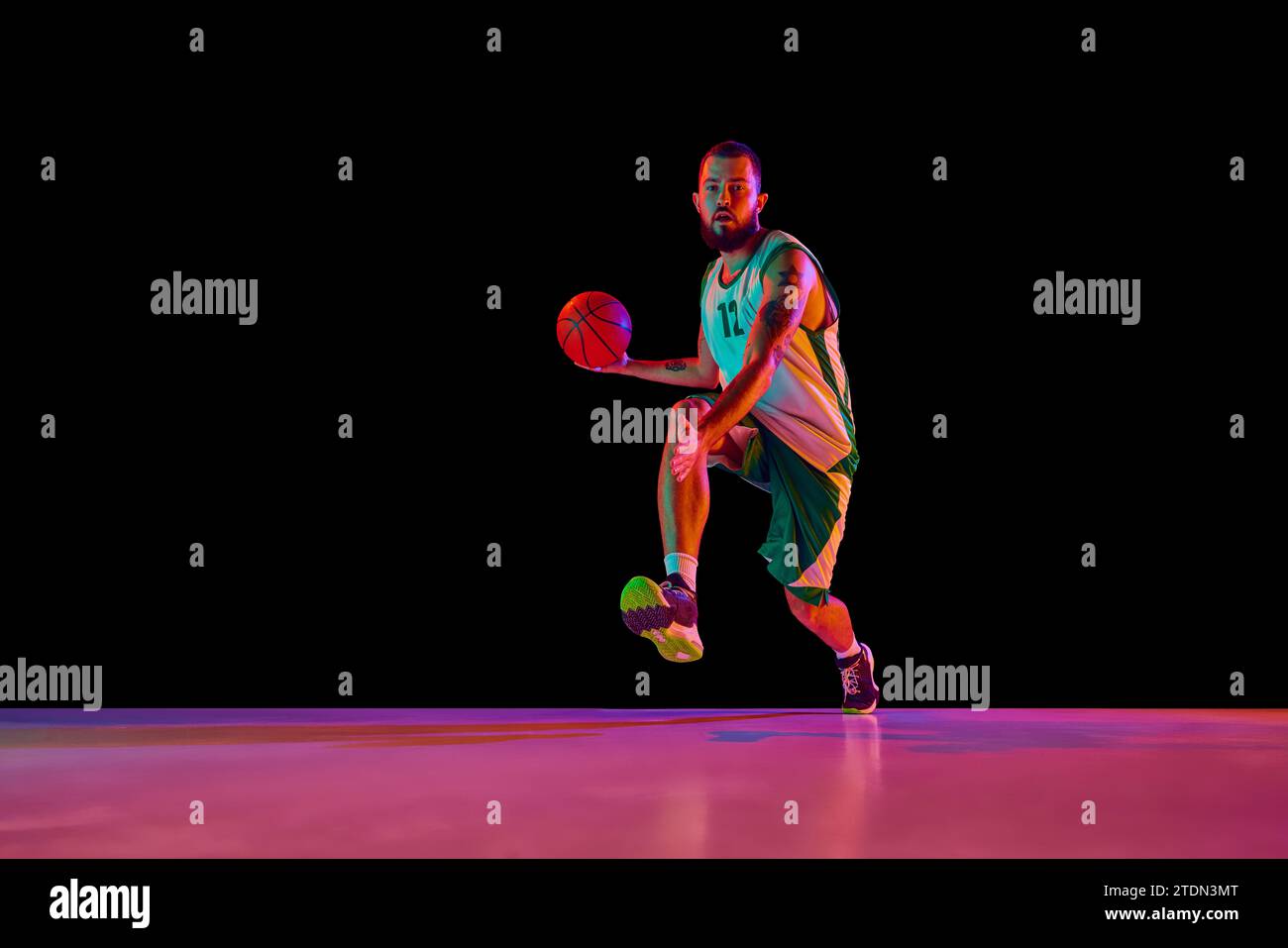 Basketball professional in uniform, exhibiting flawless dribbling ...