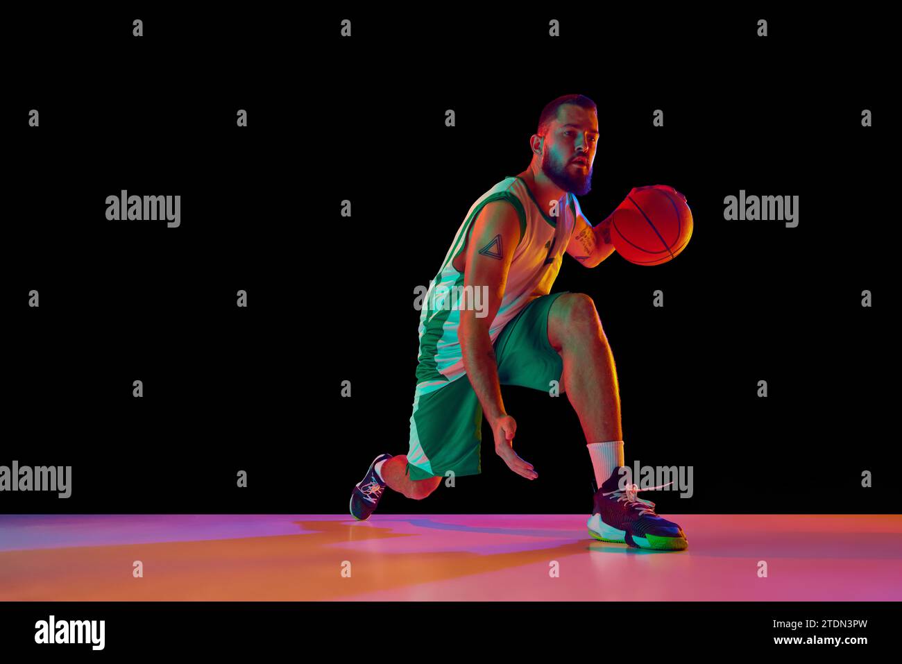 Skill and athleticism. Basketball player executing perfect slam dunk ...