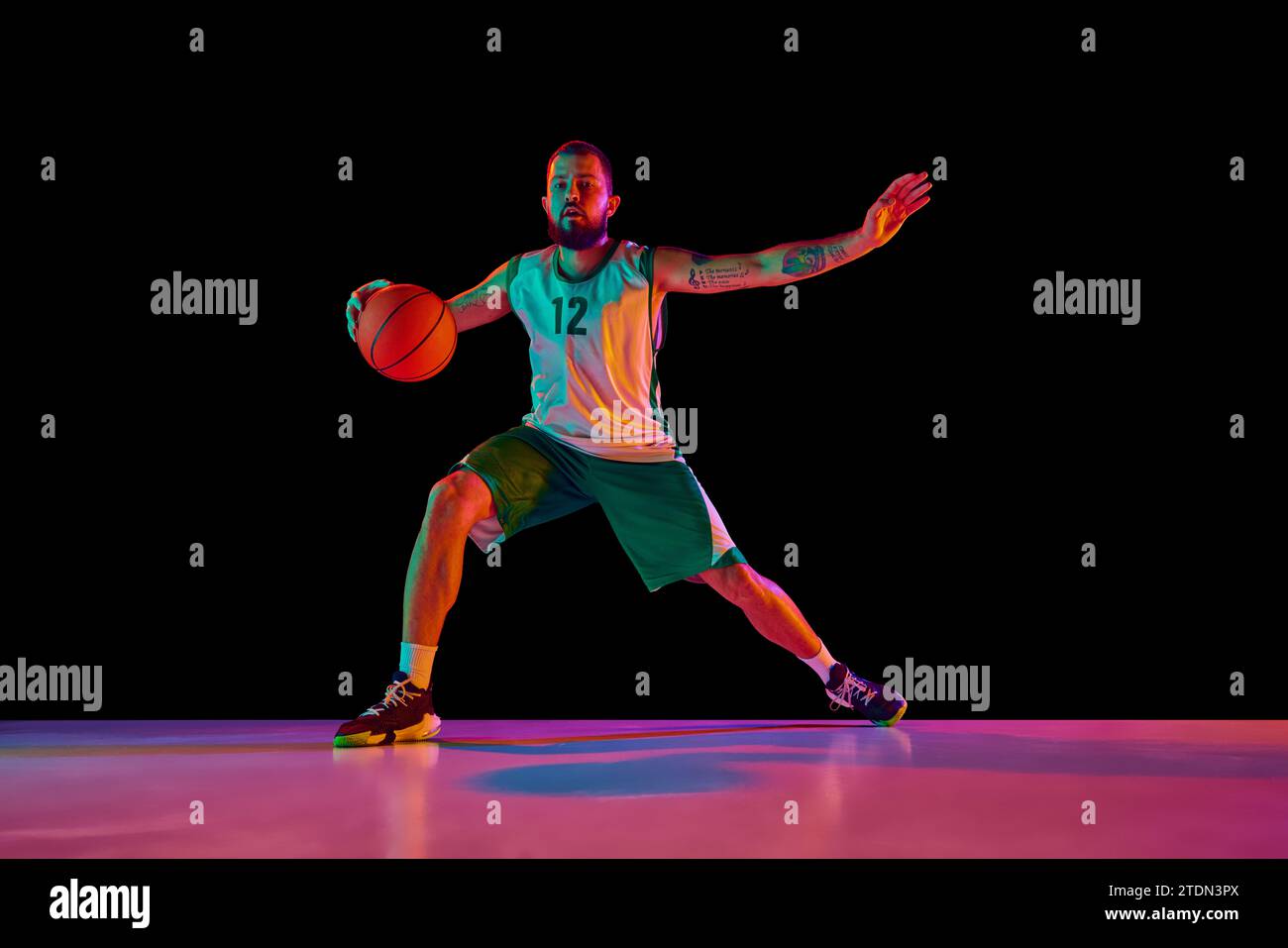 Full-length portrait of basketball player honing skills with precision ...