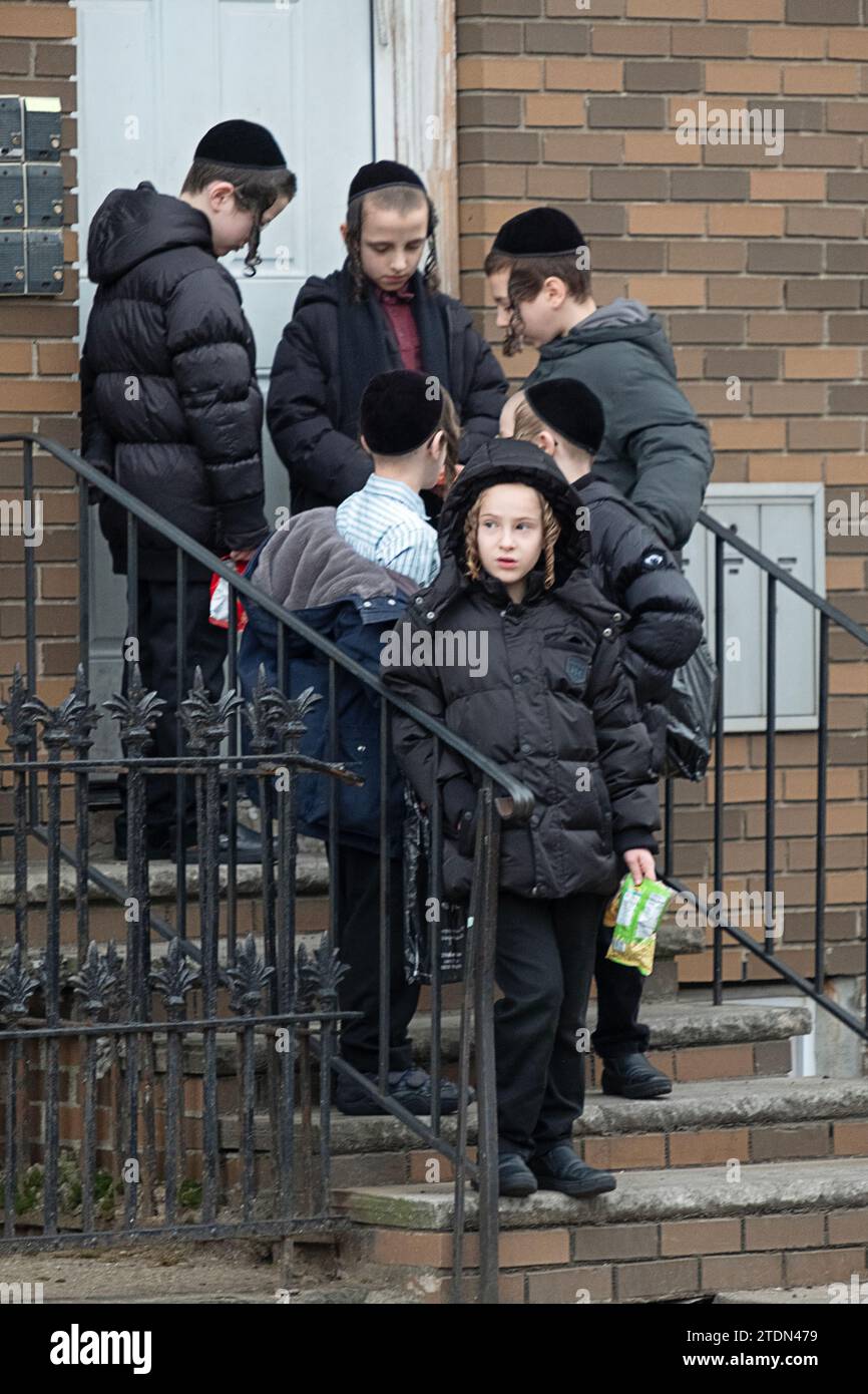 Hasidic Jewish boys wait for their school bus on a stoop in Brooklyn ...