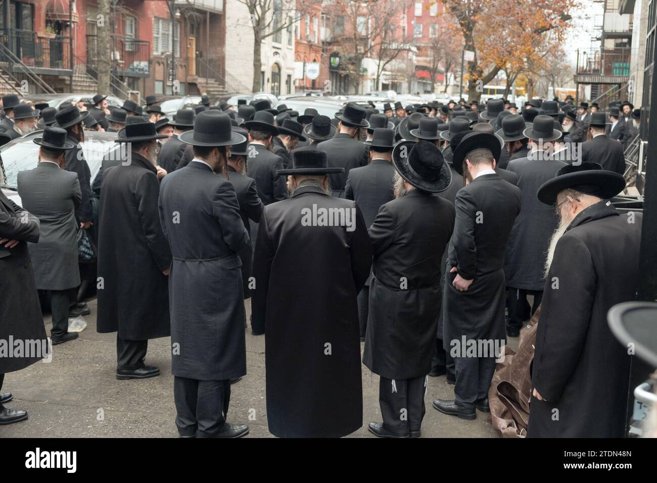 Orthodox Jewish men dressed in black attend a funeral of a Hasidic ...