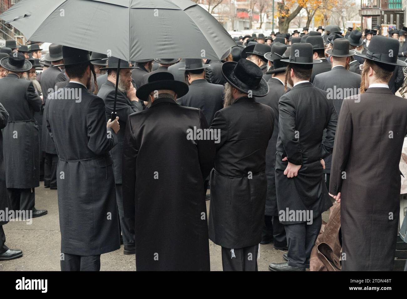 Orthodox Jewish men dressed in black attend a funeral of a Hasidic ...