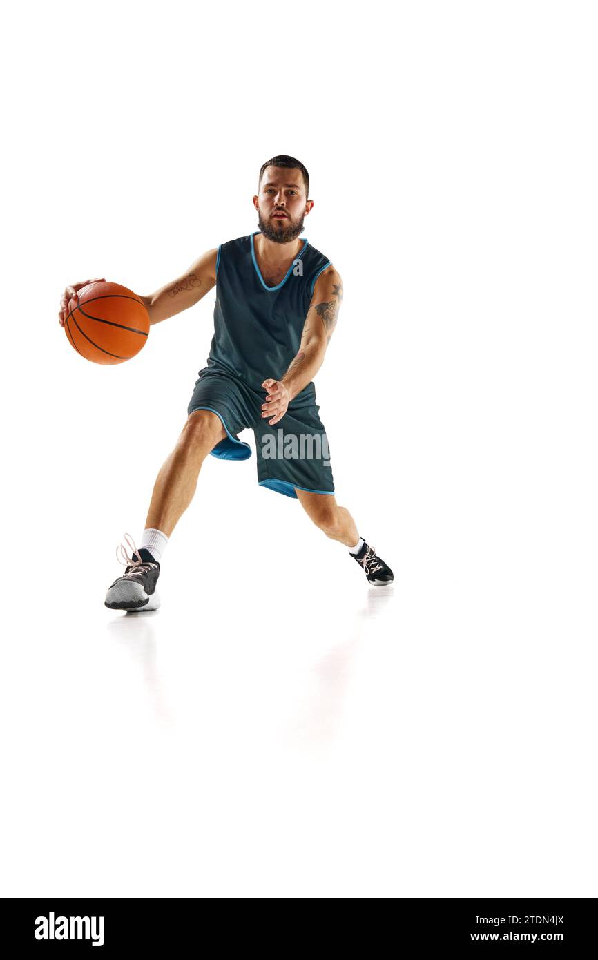 Dynamic shot capturing skilled basketball player in action, focused and ...
