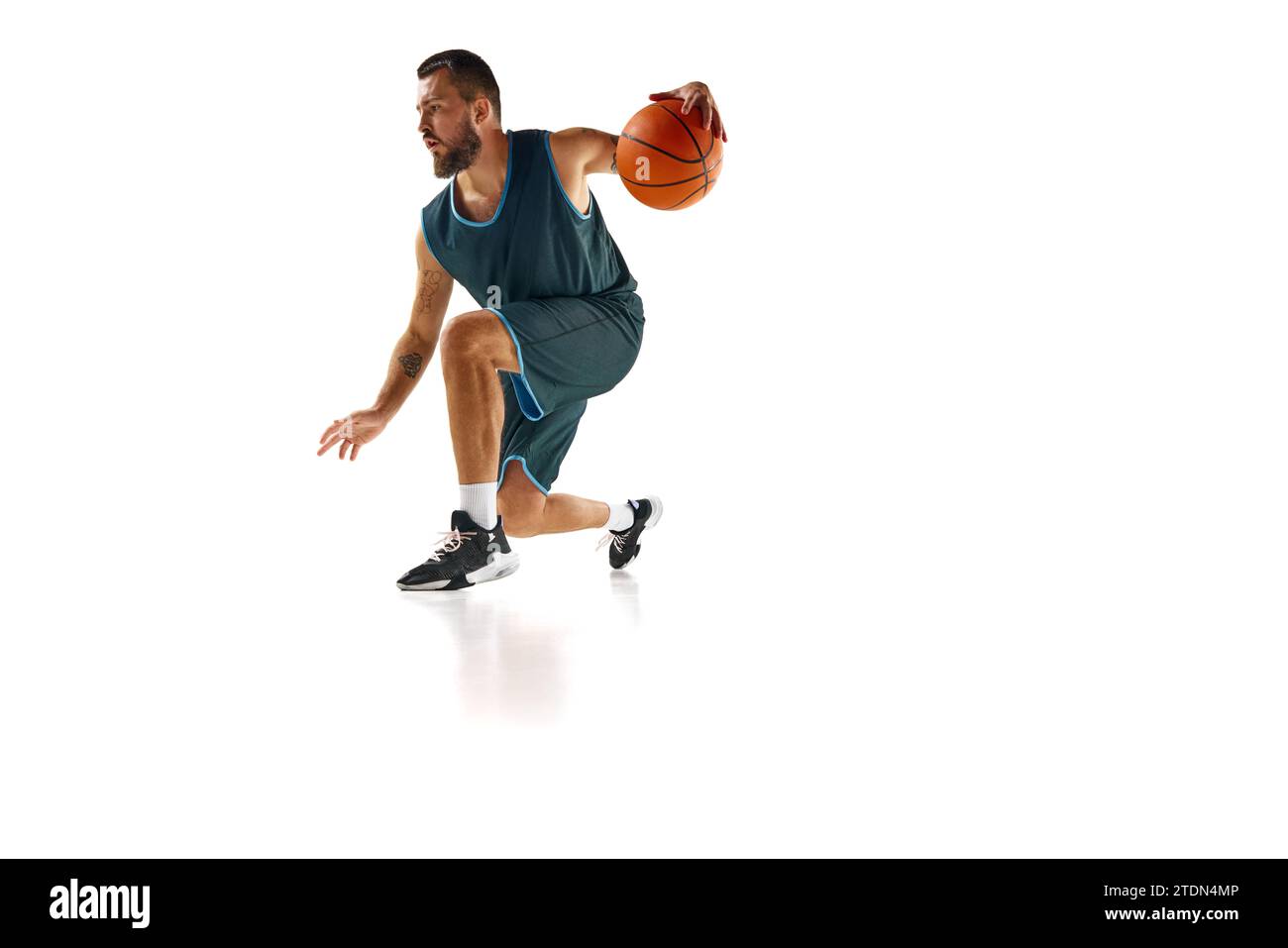 Skill and athleticism. Basketball player executing perfect slam dunk ...