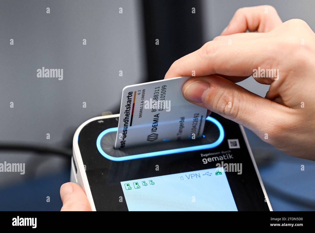 Berlin, Germany. 13th Dec, 2023. A health card is inserted into a ...