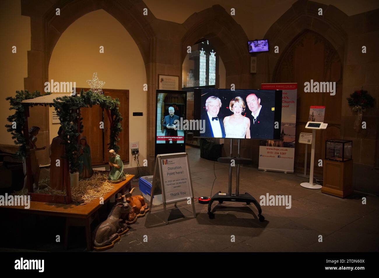 A photo is displayed on a screen ahead of the funeral for former ...