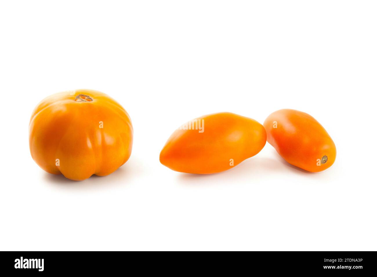 Assort of different shape of whole ripe juicy yellow tomatoes with soft ...