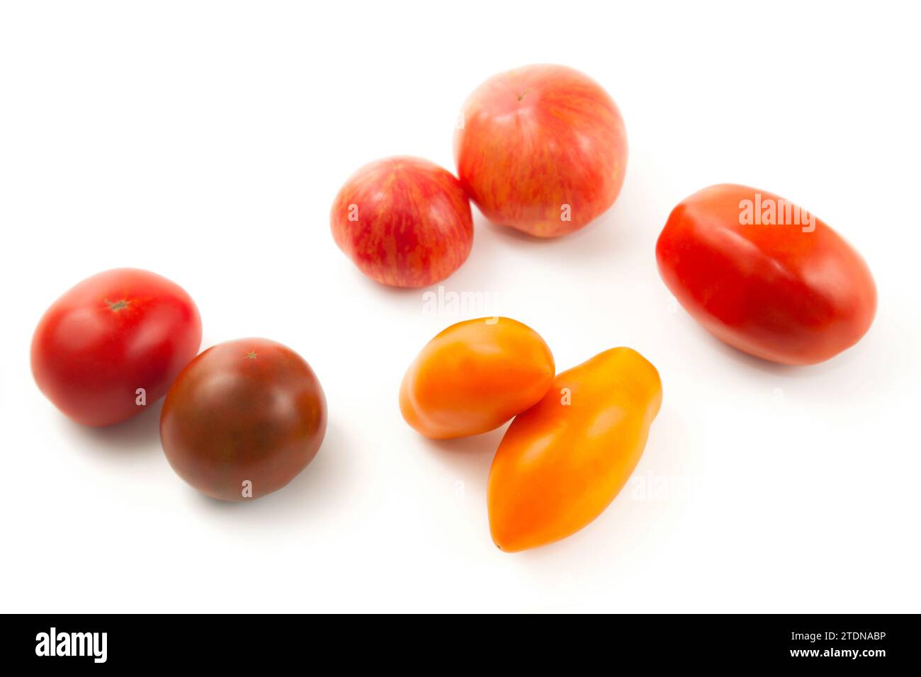 Assort of different shape and color whole ripe juicy tomatoes with soft ...