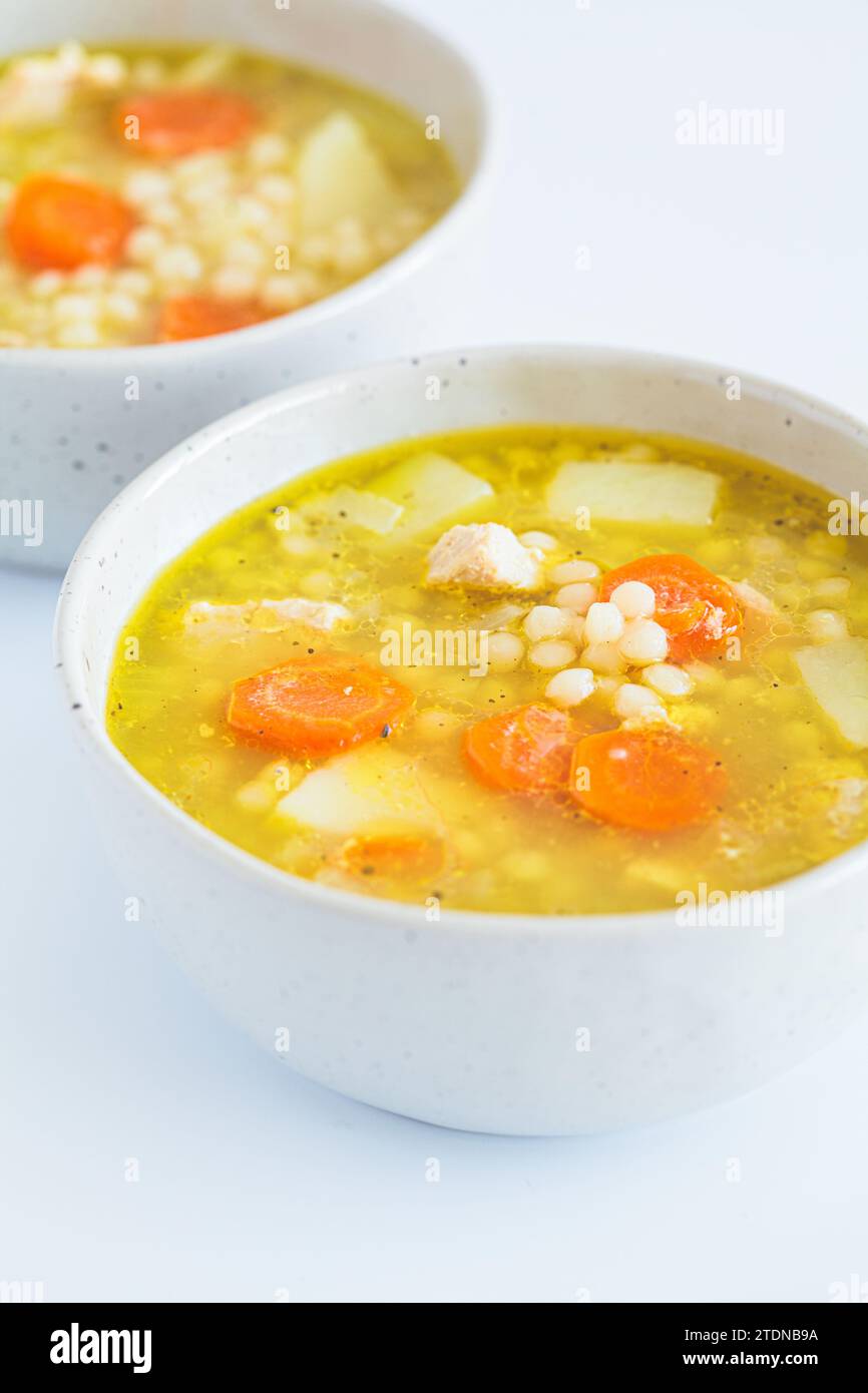 Chicken soup with vegetables and ptimtim - Israeli couscous, white ...