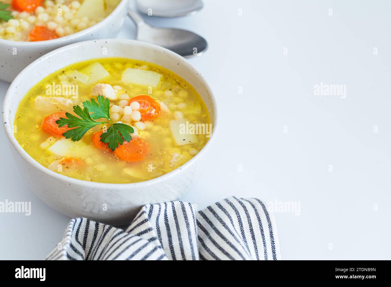 Chicken soup with vegetables and ptimtim - Israeli couscous, white ...