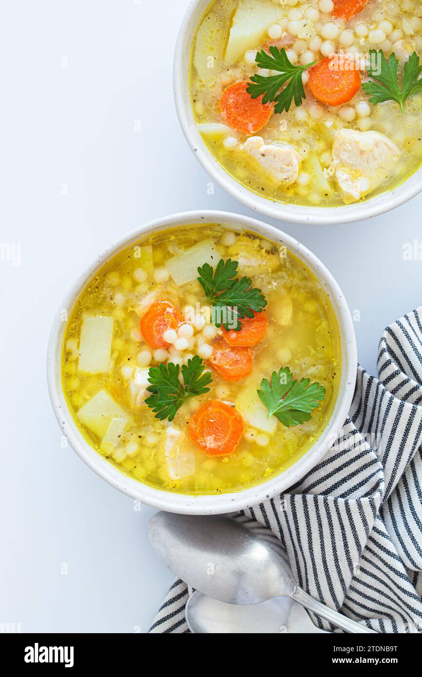 Chicken soup with vegetables and ptimtim - Israeli couscous, white ...