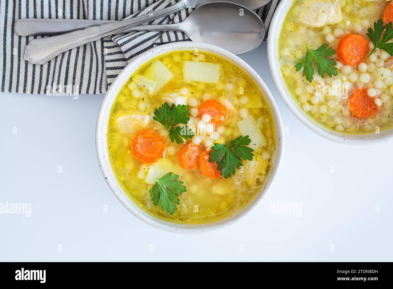 Chicken soup with vegetables and ptimtim - Israeli couscous, white ...