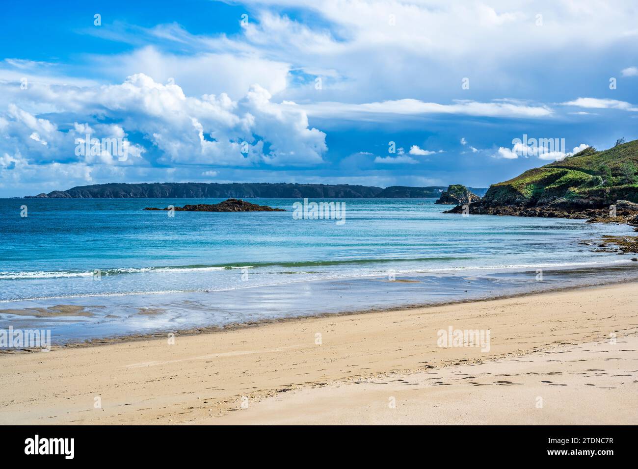 Golden sands of Shell Beach on the east coast of Herm, with distant ...