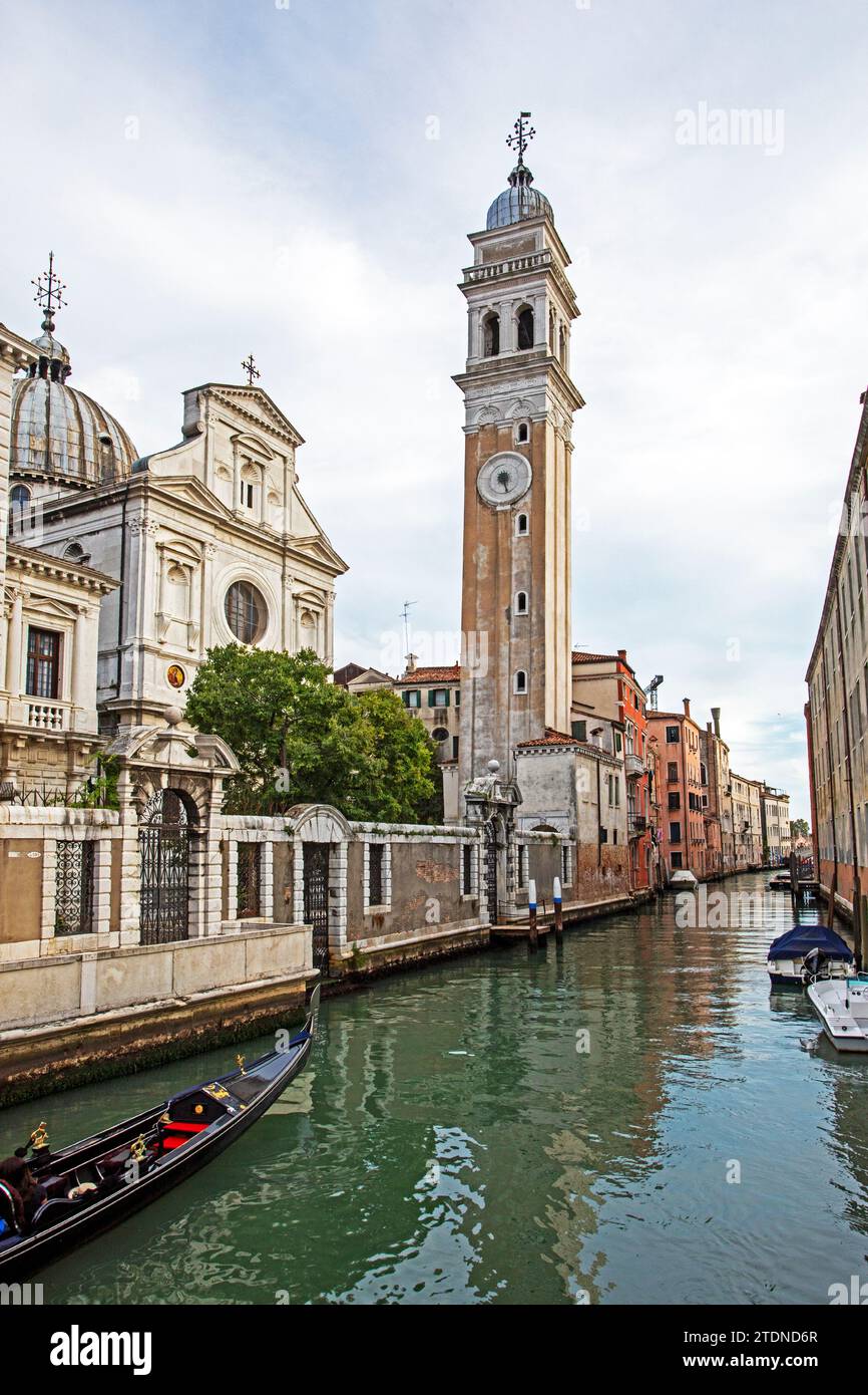 ride a gondola along the Venice canal near the clock tower. trips Stock ...