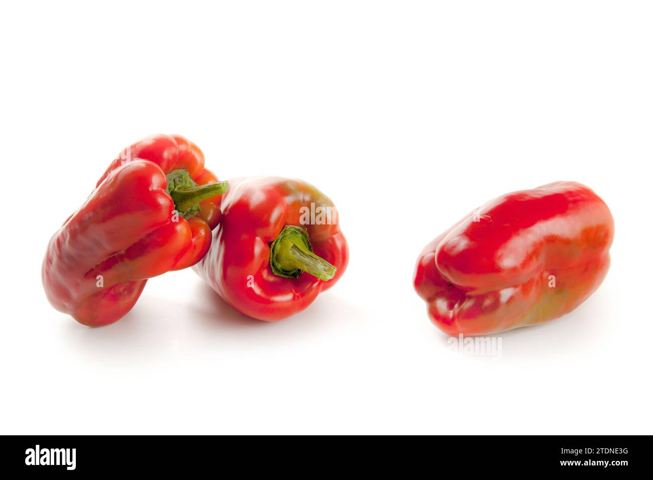Three whole red bell pepper (capsicum) known as sweet bell pepper ...